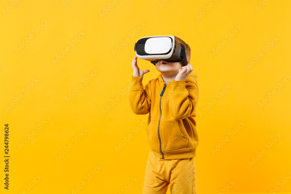 Little fun kid boy 3-4 years old wearing yellow clothes and headset of ...