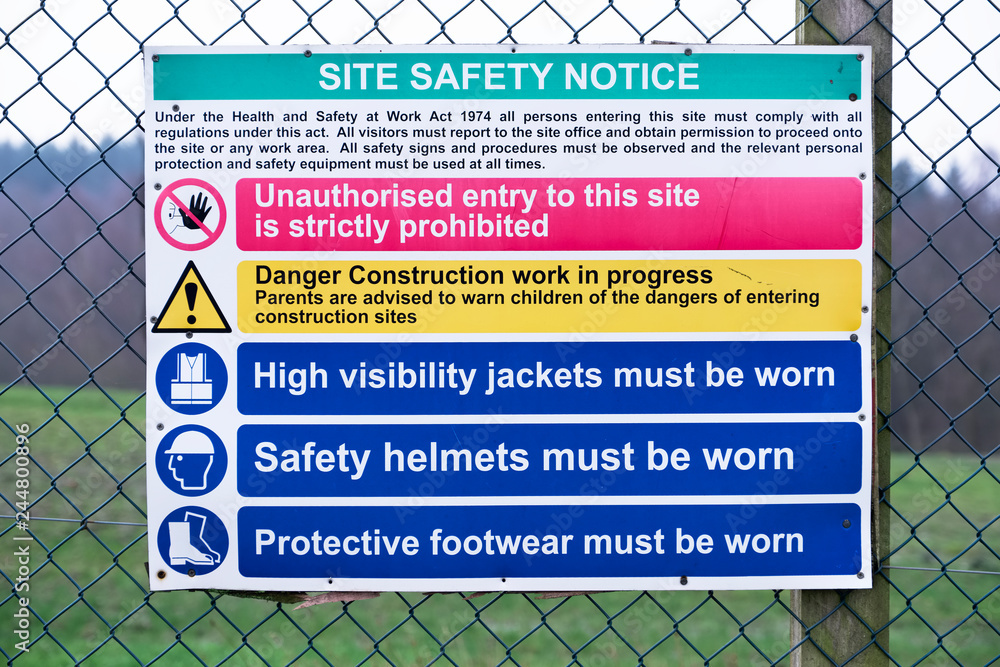 Building site construction safety notice sign on fence Stock Photo ...