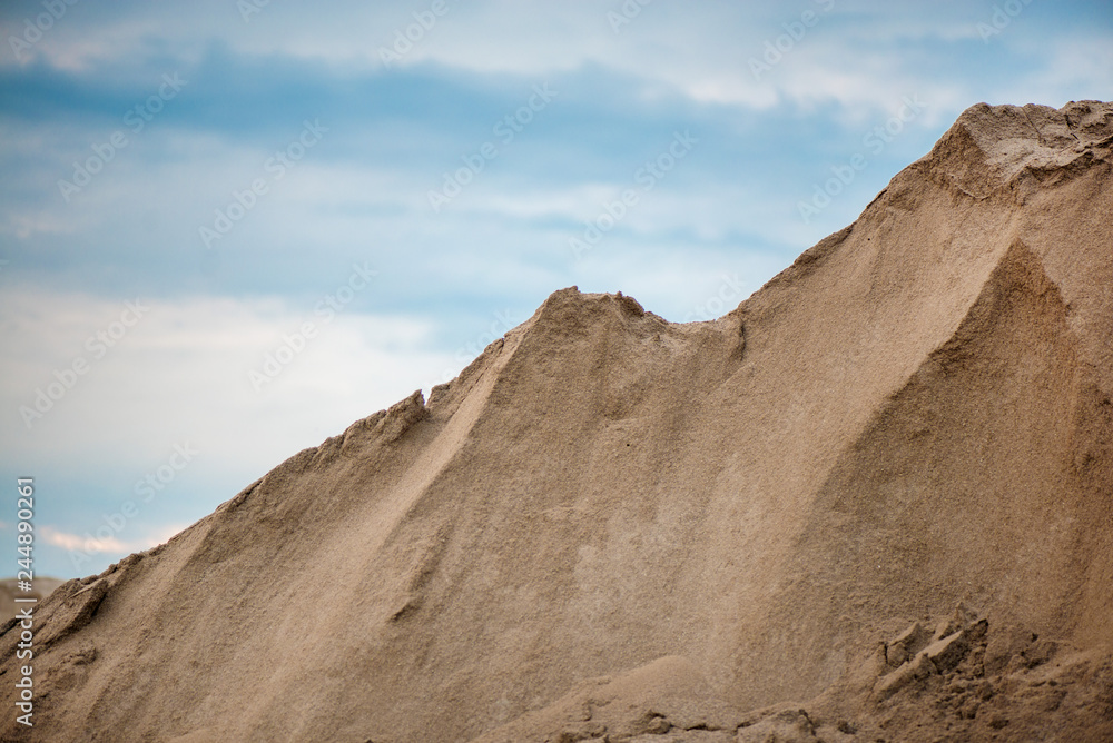 Large piles of construction sand and gravel used for asphalt production ...