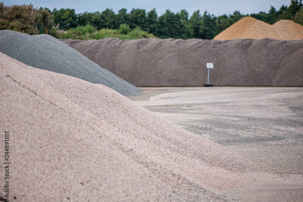 Large piles of construction sand and gravel used for asphalt production ...