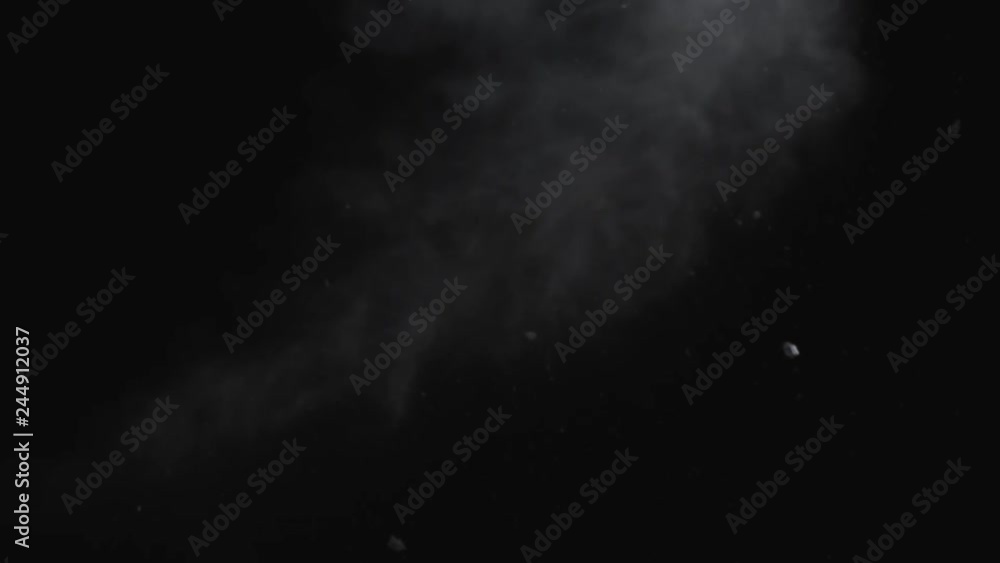 Dusty bullet hit on a wall with chunks of debris flying out. White ...