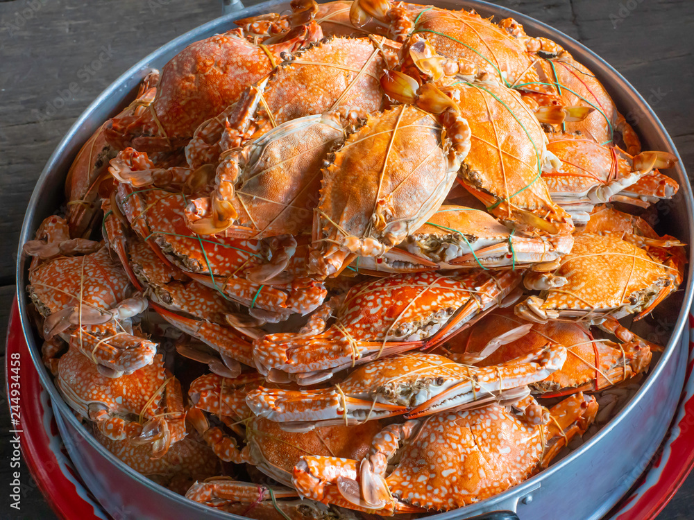 Jumbo steamed crab Being stacked ready to eat in a container. Stock ...