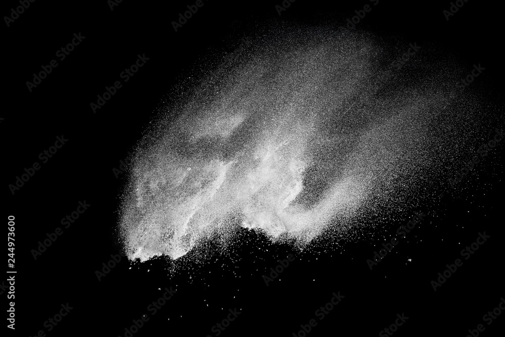 Bizarre forms of white powder explosion cloud against black background ...