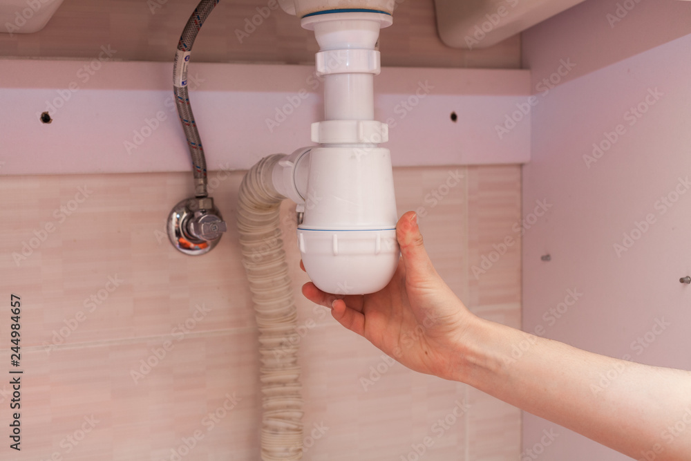 Clearing of blocked hammered polluted plastic U siphon for wash basin ...