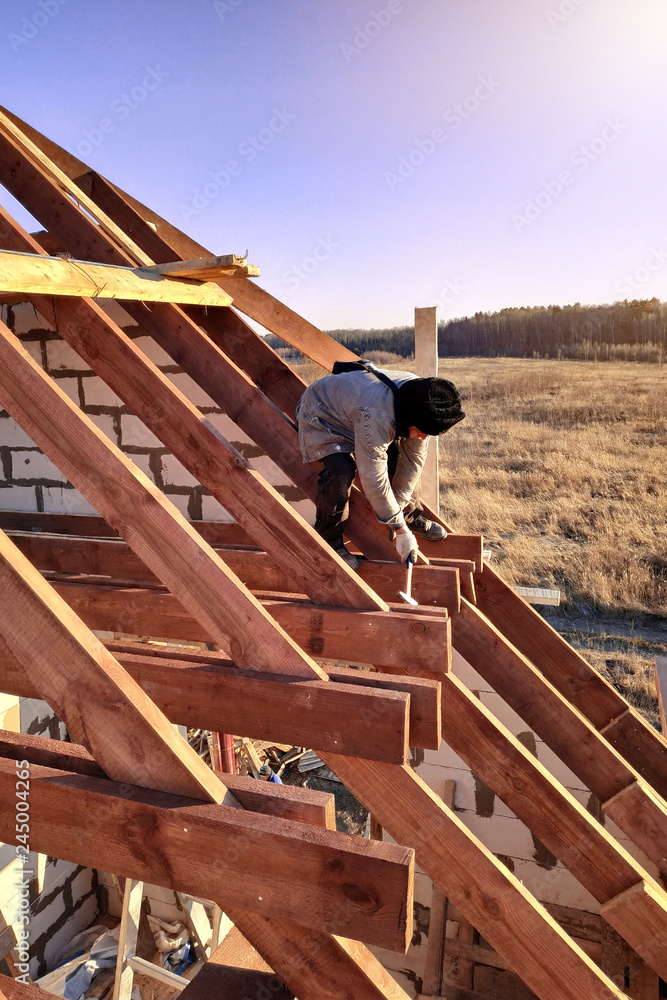 Layout and installation of roof rafters on a new commercial residential ...