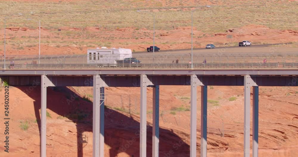 An RV (recreational vehicle camper) fifth-wheel motorhome crosses a ...