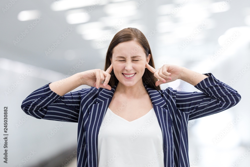 Portrait of a young girl standing on the subway platform covered her ...