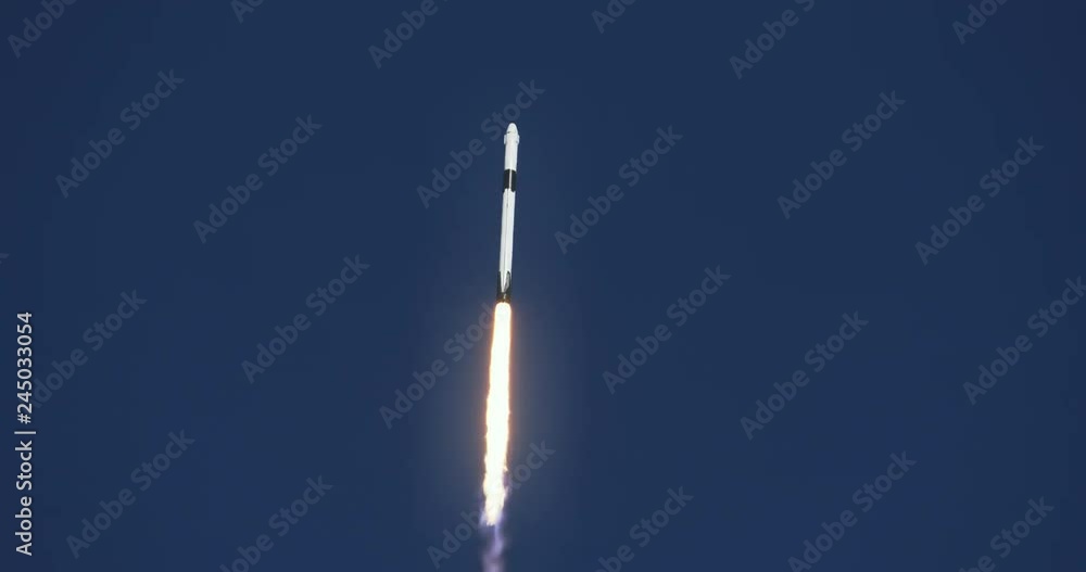 Space rocket or ICBM missile soars into space with bright trail of ...