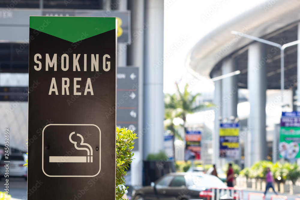 Smoking area sign outside the building. Stock Photo | Adobe Stock