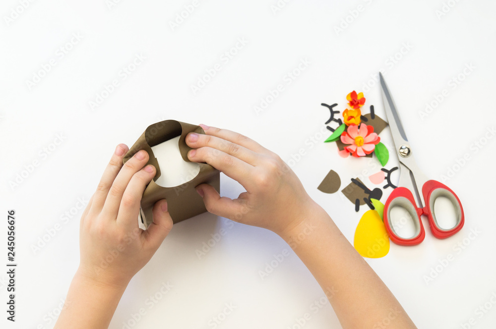 Child making gift a bear box. Teddy bear out of paper craft. Packaging ...