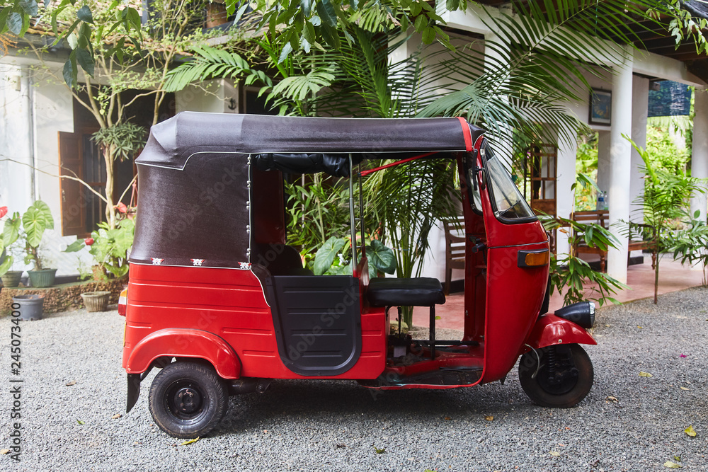 Red Tuk-tuk taxi on road of Sri Lanka. Ceylon travel car. rickshaw ...