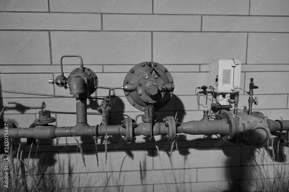 Gas meter, back flow preventer, and pressure regulator Stock Photo ...