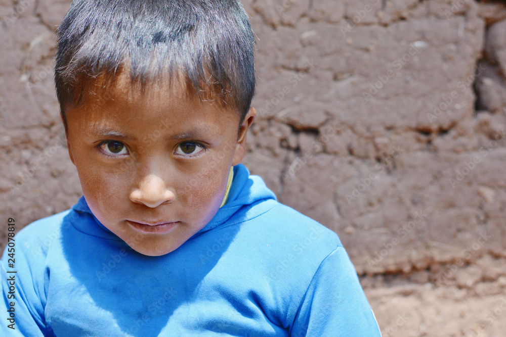 Sad little latin american boy outside. Stock Photo | Adobe Stock