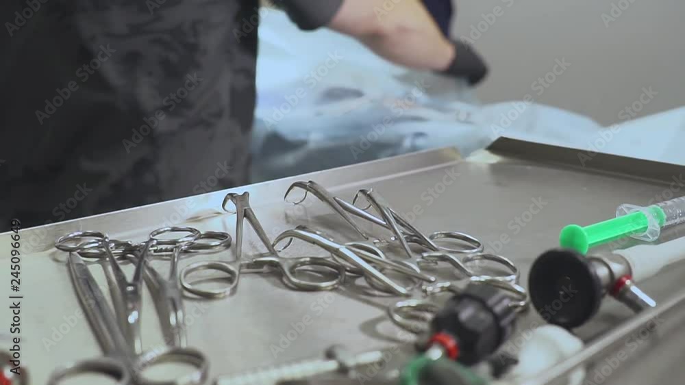 Close up hands and a table of surgical nurse during laparoscopic ...