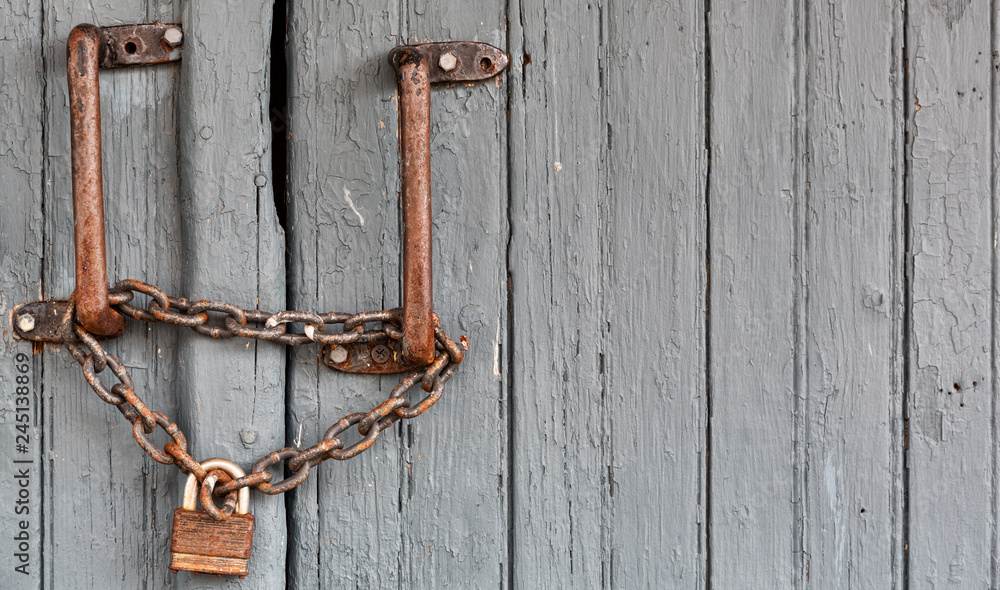 Very old lock on a wood door Stock Photo | Adobe Stock