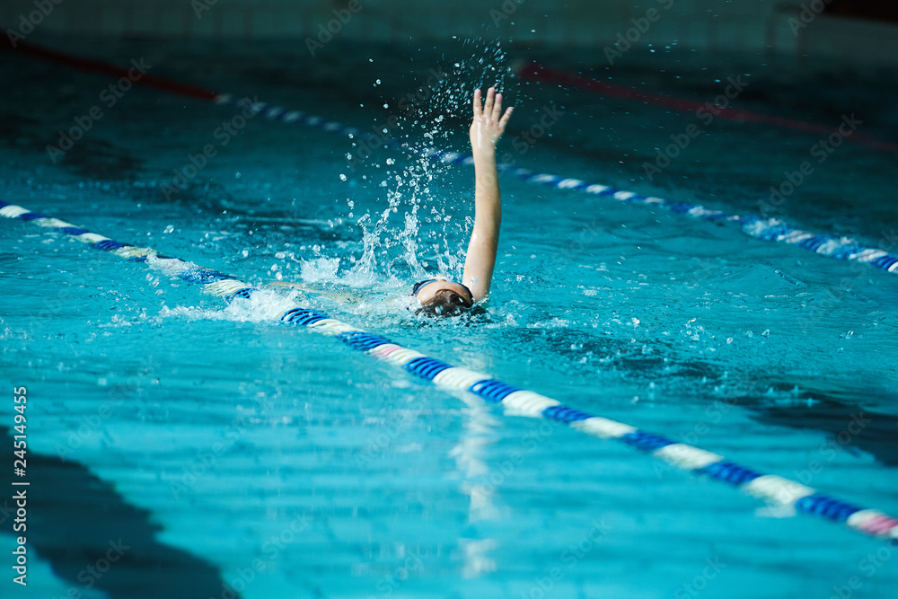 Children swimming freestyle at swimming lesson. Elementary school ...