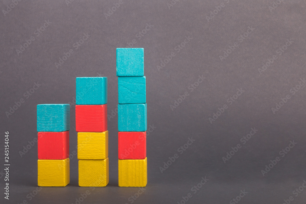 Toy wooden blocks as financial graph. Graph with four 4 steps. Growing ...