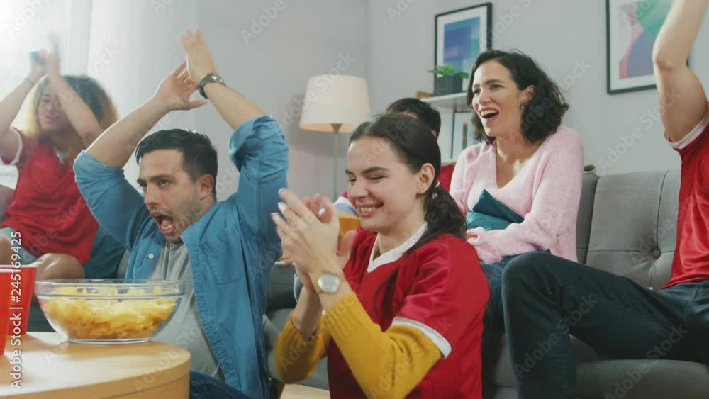 At Home Diverse Group Friends Watching TV Together, Eating Snacks and ...