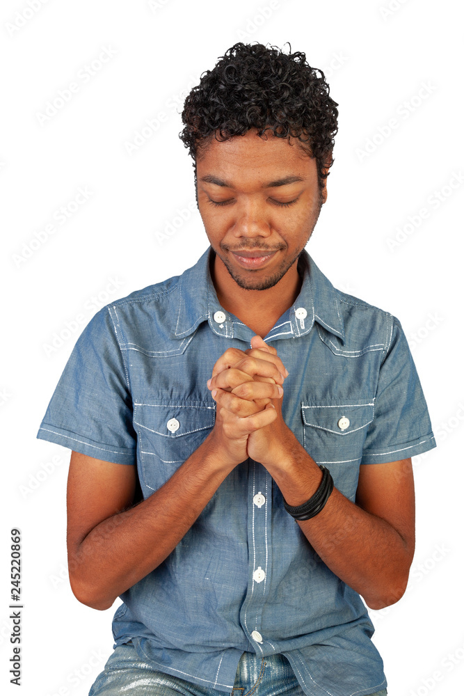 Young Indo-Mauritian or Creole Pastor in training sitting with hands in ...