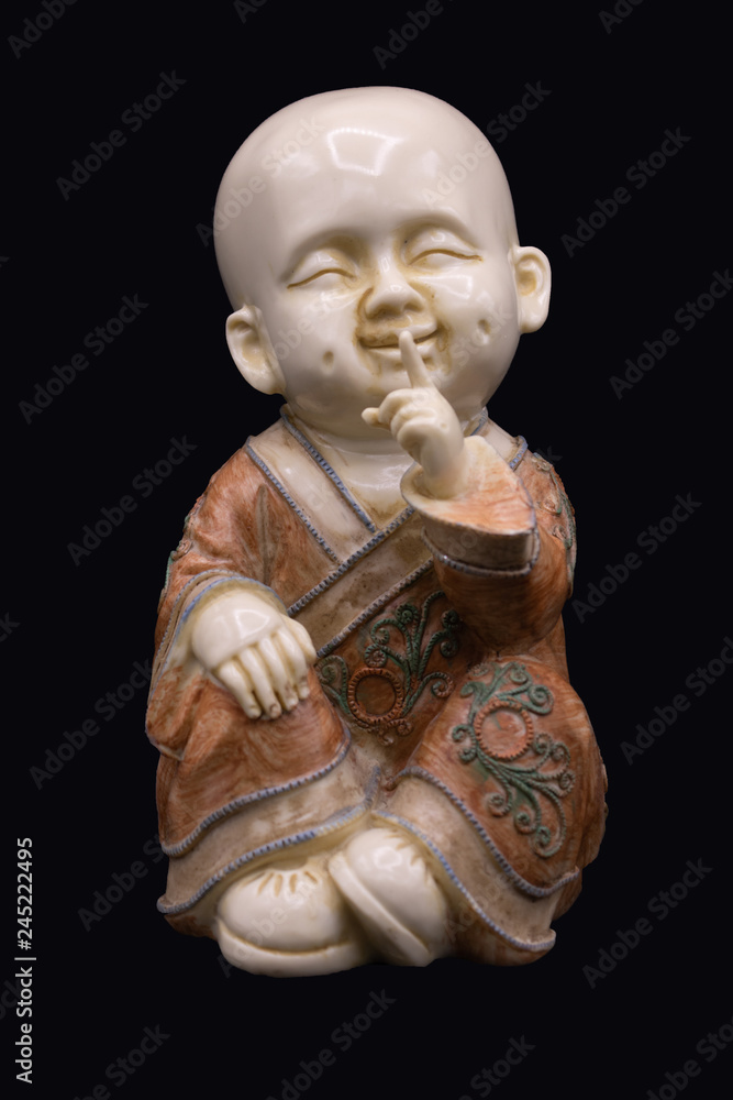 This is one of The three wise Buddha, the "speak no evil" that are a ...