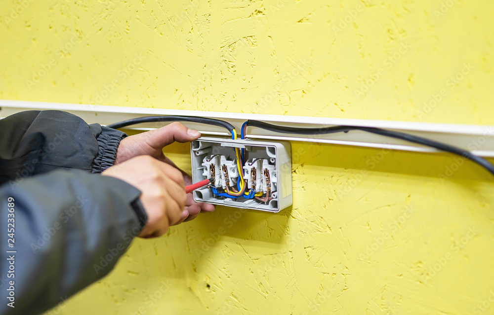 The process of connecting cables to a dual socket Stock Photo | Adobe Stock