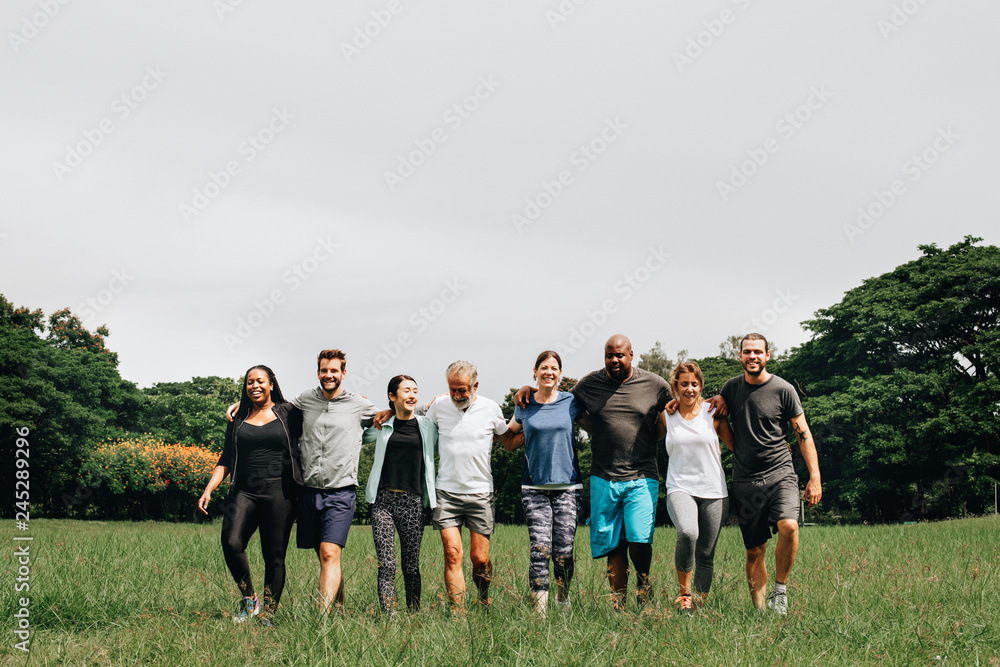 Group of people hugging each other in the park Stock Photo | Adobe Stock