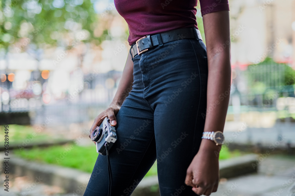Beautiful model with an analog camera Stock Photo | Adobe Stock