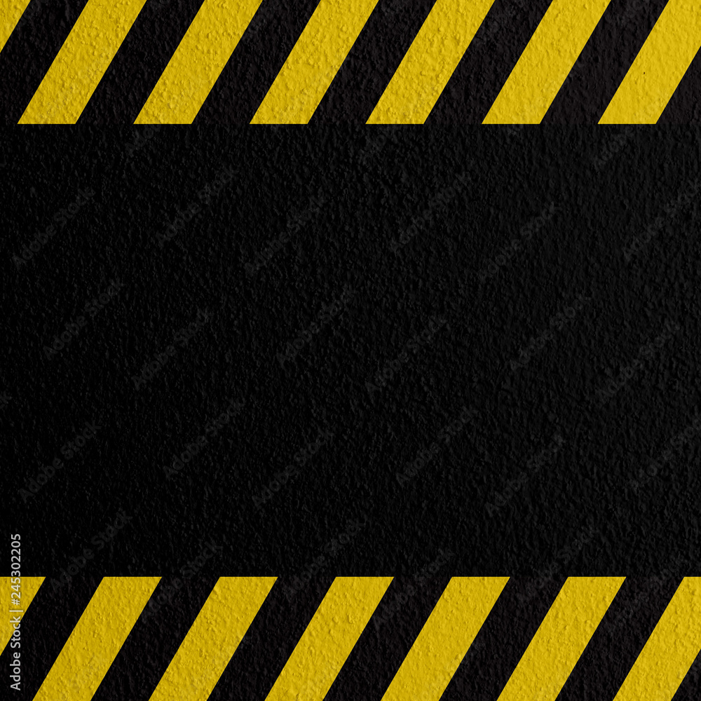 Safety sign yellow and black on mortar texture warning to be careful of ...