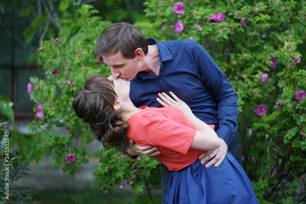 cute sweet adult european love couple walking in the green park and ...