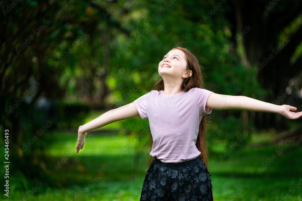 Happy cute little girl playing in the outdoor park in summer. Child ...