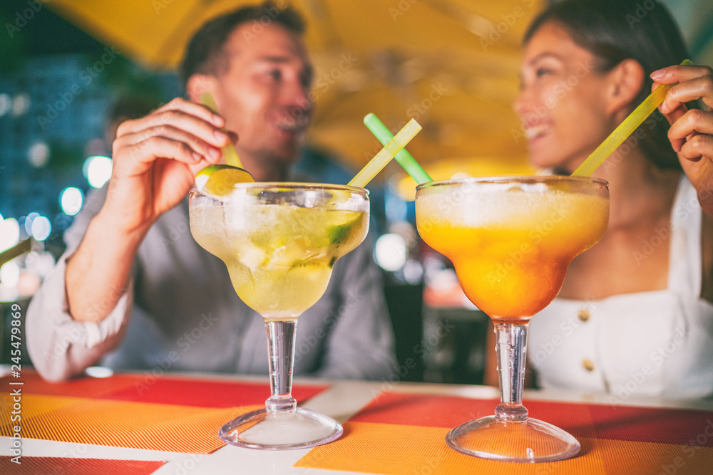 Night out drinking giant margaritas cocktails party couple going out at ...