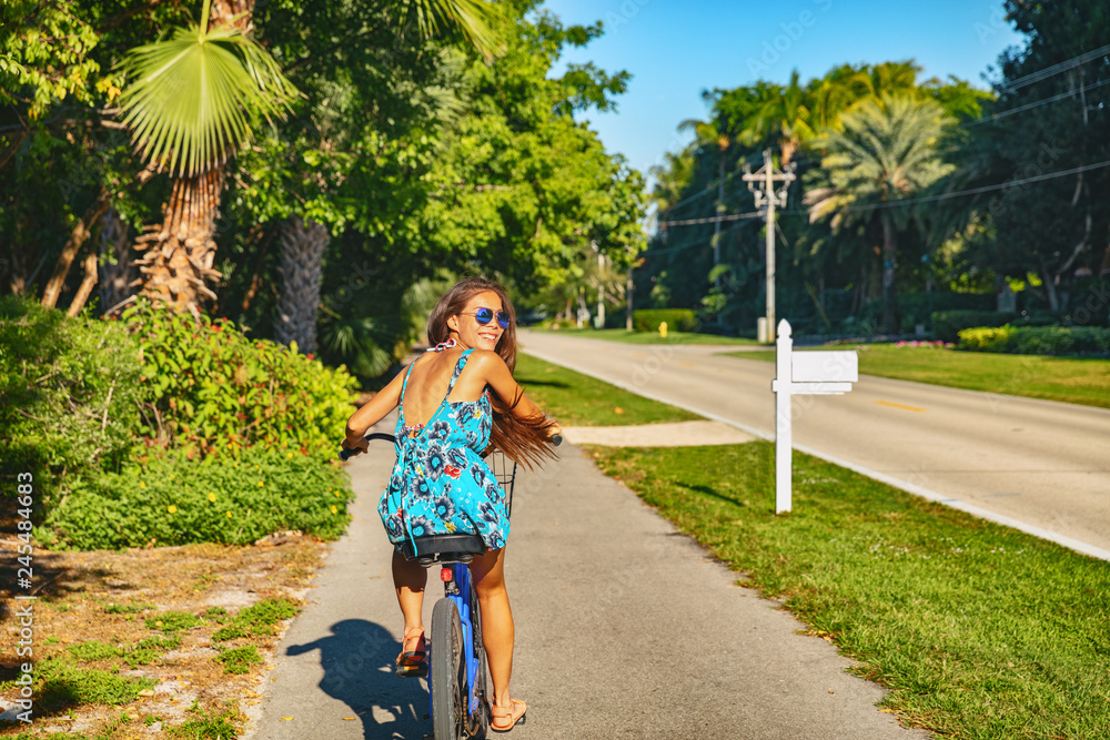 Biking girl recreational cycling happy tourist looking back happy ...