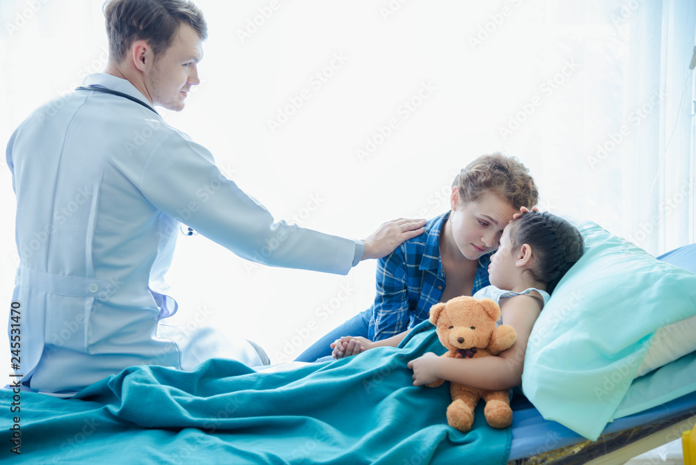 Medical doctor caring and examining kid patient with .Mom woman sad and ...
