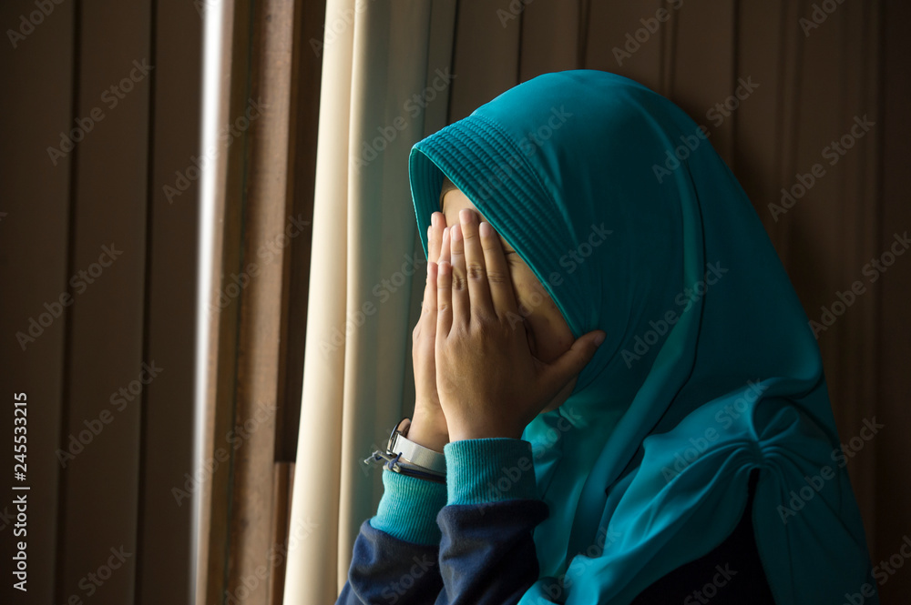 young sad and depressed Muslim woman in Islam traditional Hijab head ...