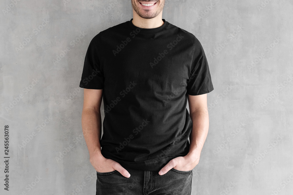 Mock up of young man body in empty black t-shirt isolated on textured ...