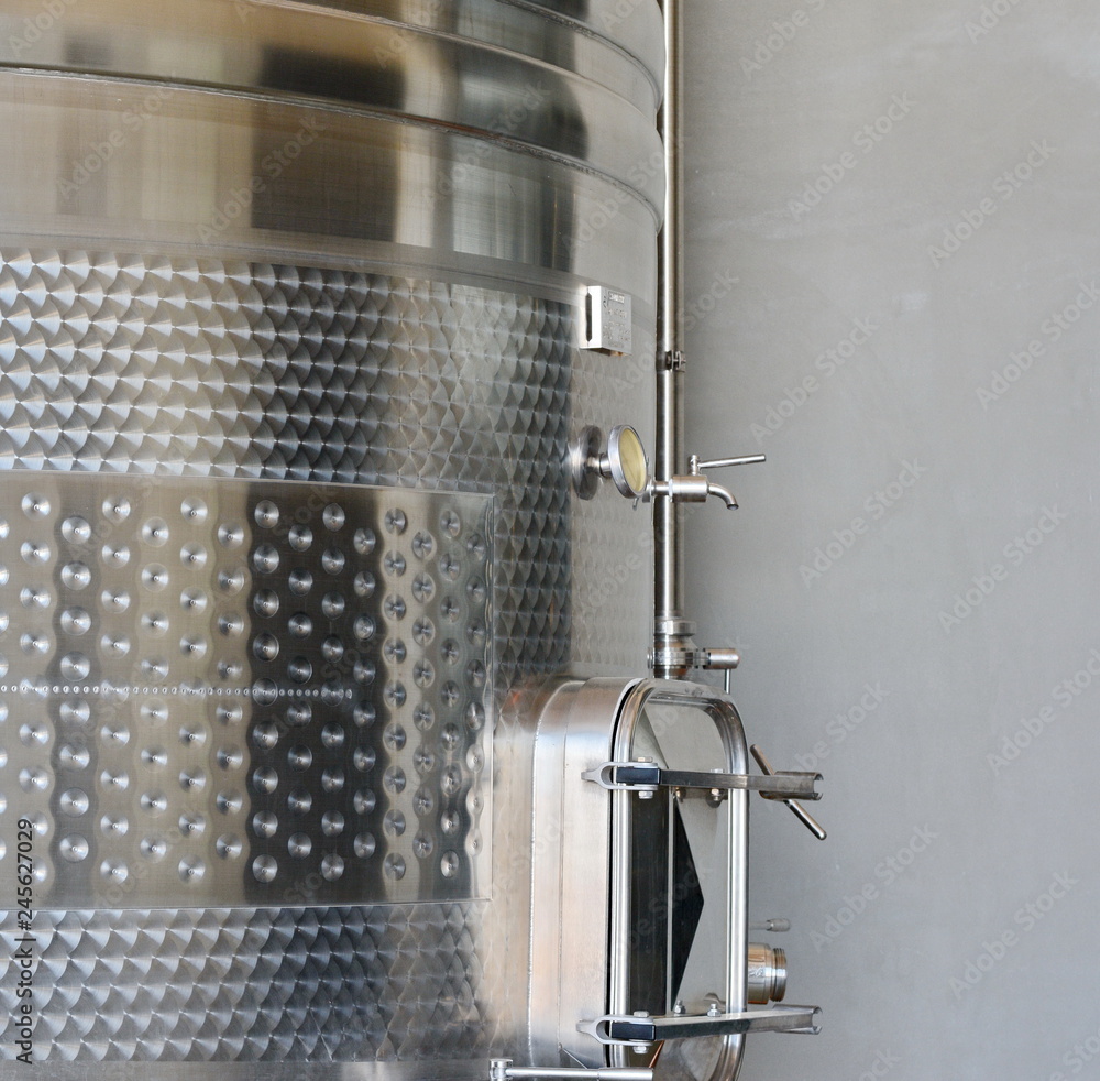 Modern wine factory with new large tanks for the fermentation. modern ...