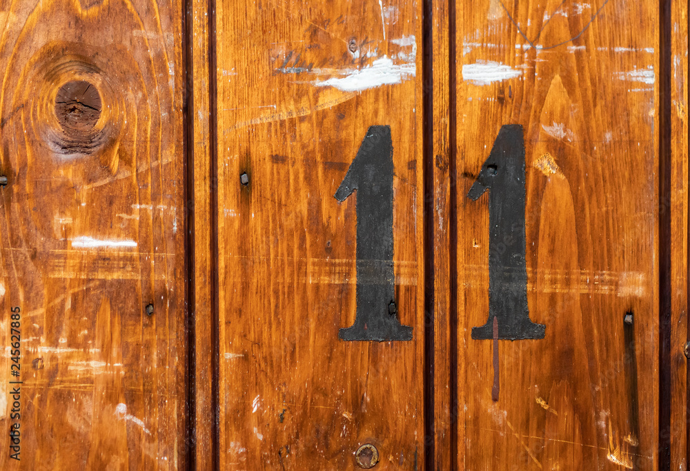 number 11 on door of storage room for tenants in century-old apartment ...