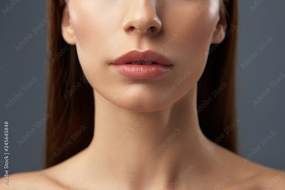 Charming young woman with beautiful full lips Stock Photo | Adobe Stock