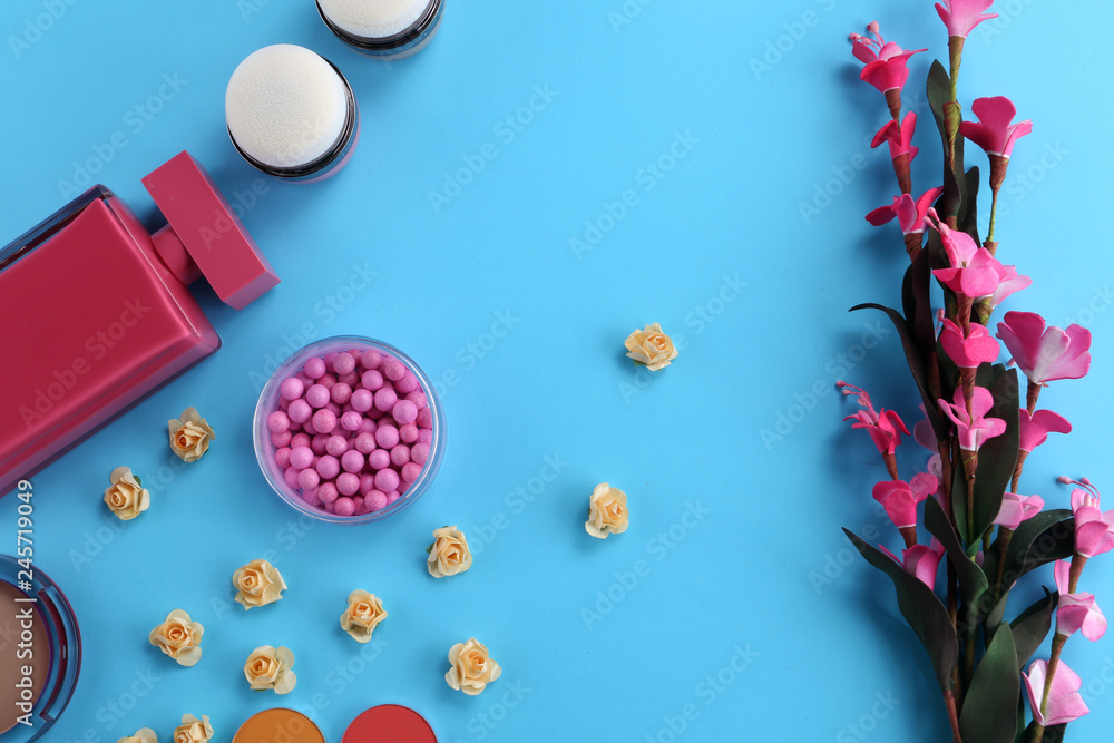 Beauty background with facial cosmetic products, leaves and cherry ...