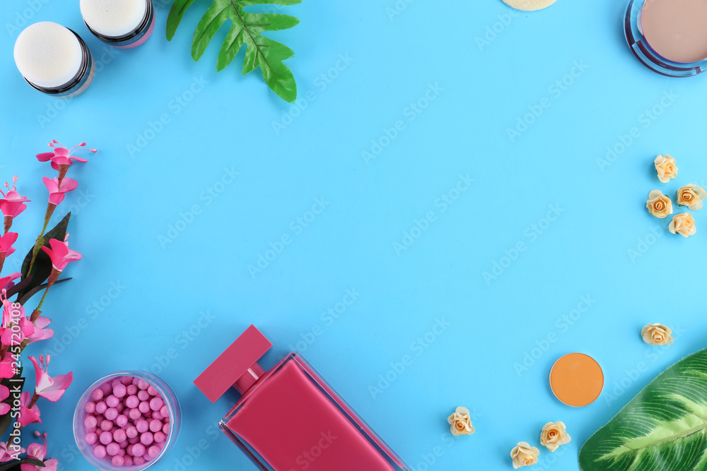 Beauty background with facial cosmetic products, leaves and cherry ...