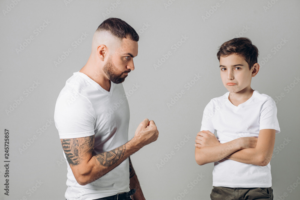 Bearded angry frustrated father scolds his son. close up photo ...