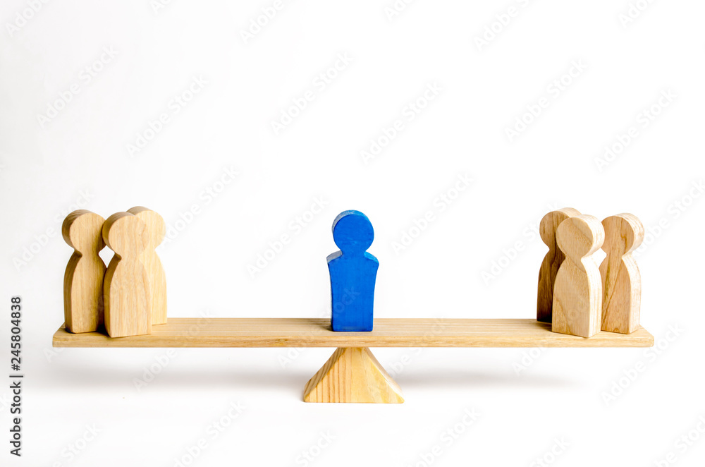 The leader stands on the scales between two groups of people. Resolving ...