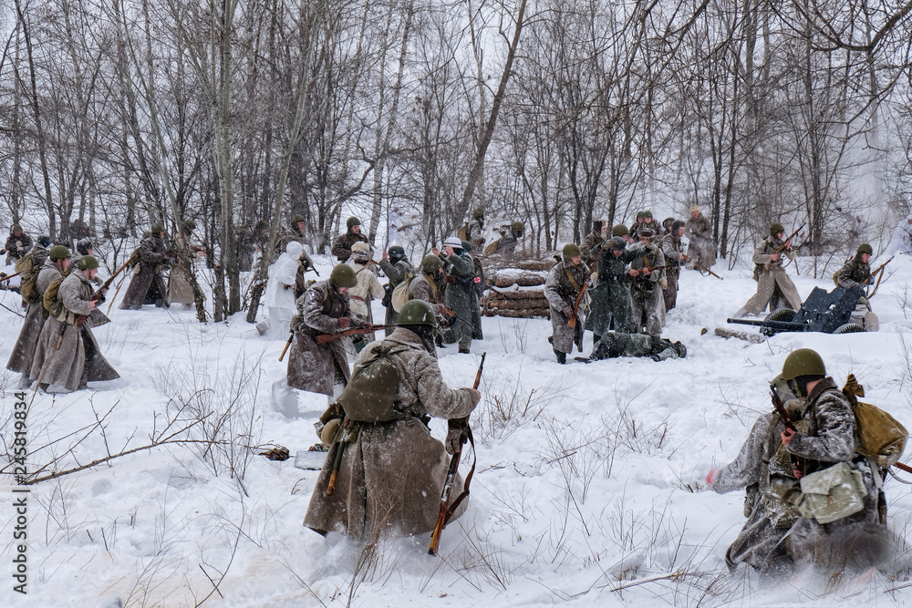 Soviet and German soldiers in winter reconstruction of World War 2 ...