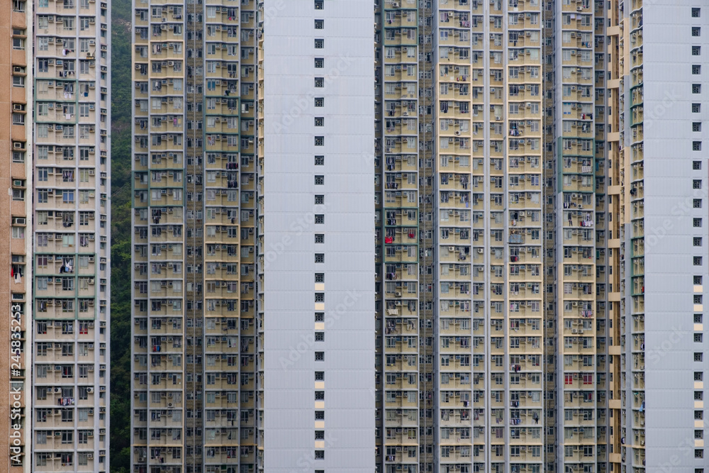 Brown and gray all of multistoried apartment building with many same ...