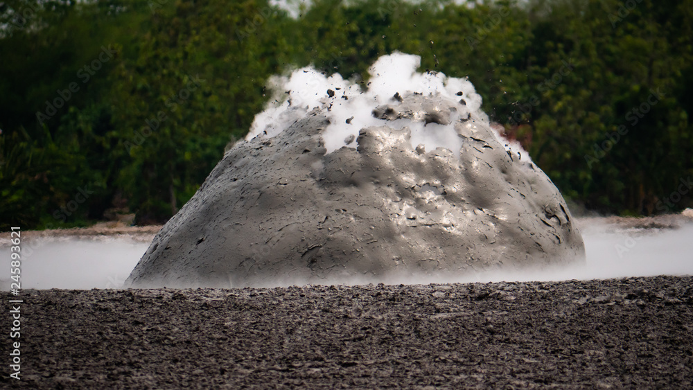 mud volcano with bursting bubble bledug kuwu. volcanic plateau with ...