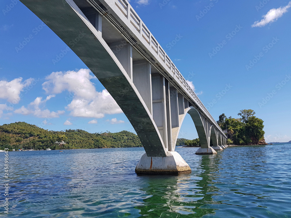 under big white bridge on atlantic ocean connecting two islands in ...