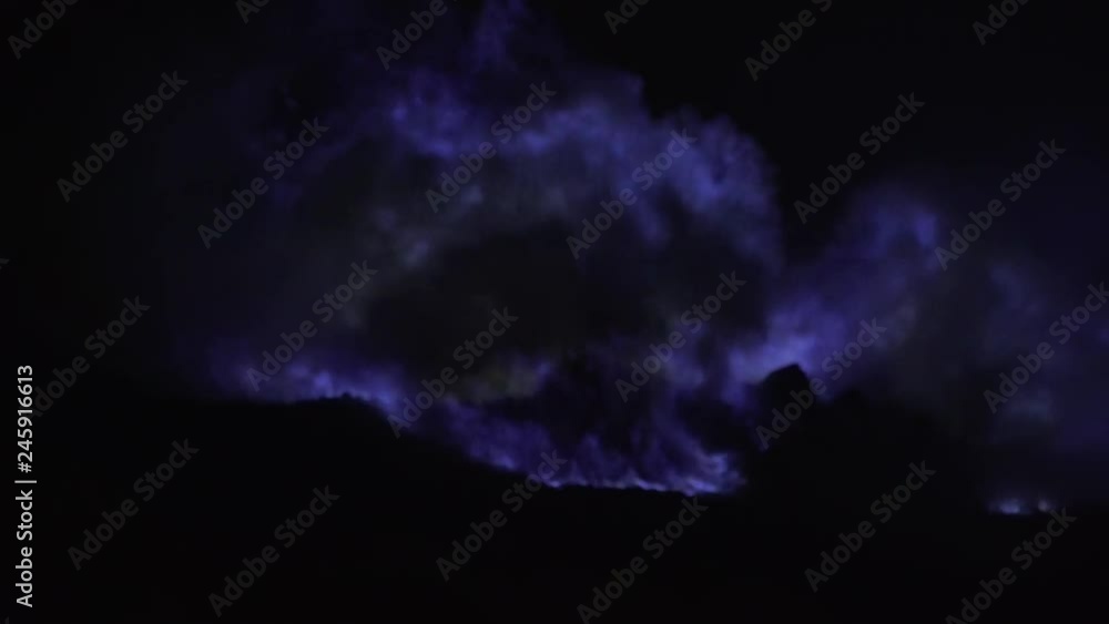 Blue fire of burning sulfur in a crater of a volcano Kawah ijen, Java ...