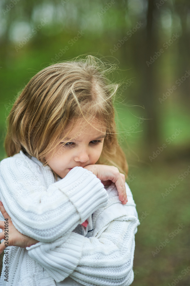 Portrait of sad unhappy little girl. Little sad child is lonesome ...