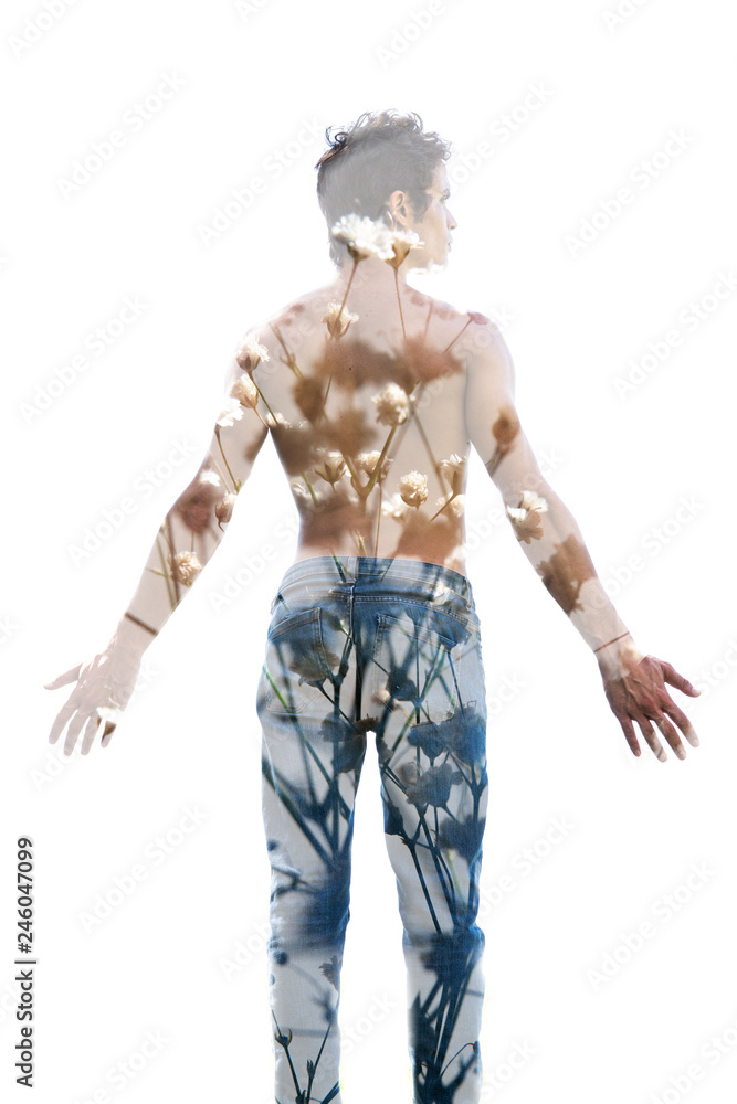 Double exposure, of a young shirtless man blended with delicate flowers ...