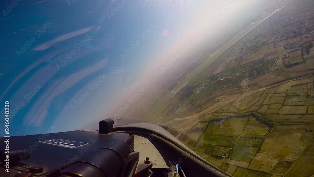 Fighter jet turning in the sky, low passing to the ground, captured ...